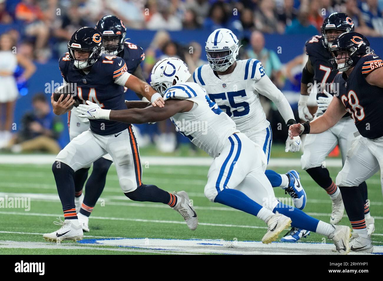 Chicago Bears quarterback Nathan Peterman (14) runs from the grasp of ...