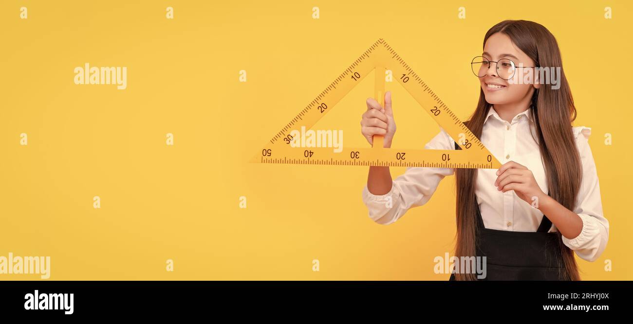 mathematics. happy teen girl hold triangle. back to school. algebra and ...