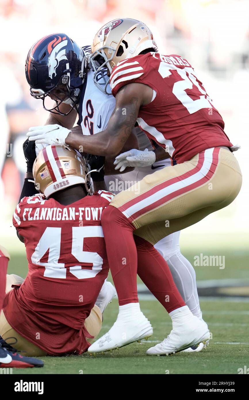 Denver Broncos fullback Michael Burton, top left, is tackled by San ...