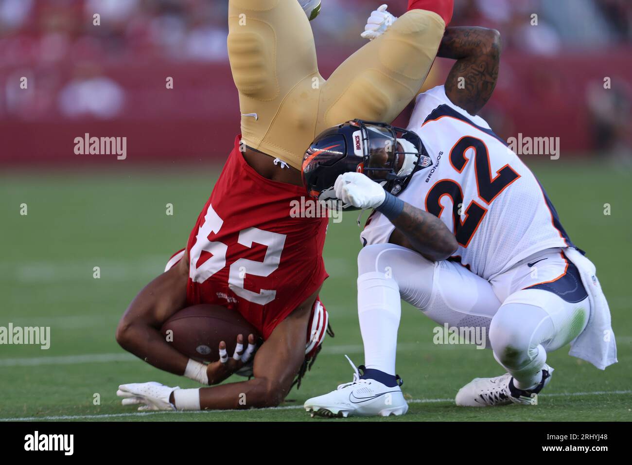 Denver Broncos safety Kareem Jackson (22) tackles San Francisco 49ers ...