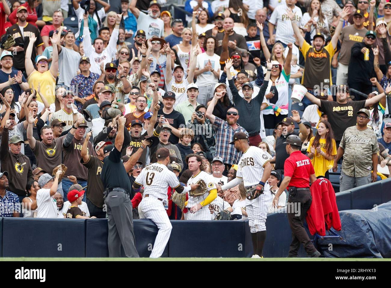 San Diego Padres left fielder Ben Gamel, center, reacts after making a ...