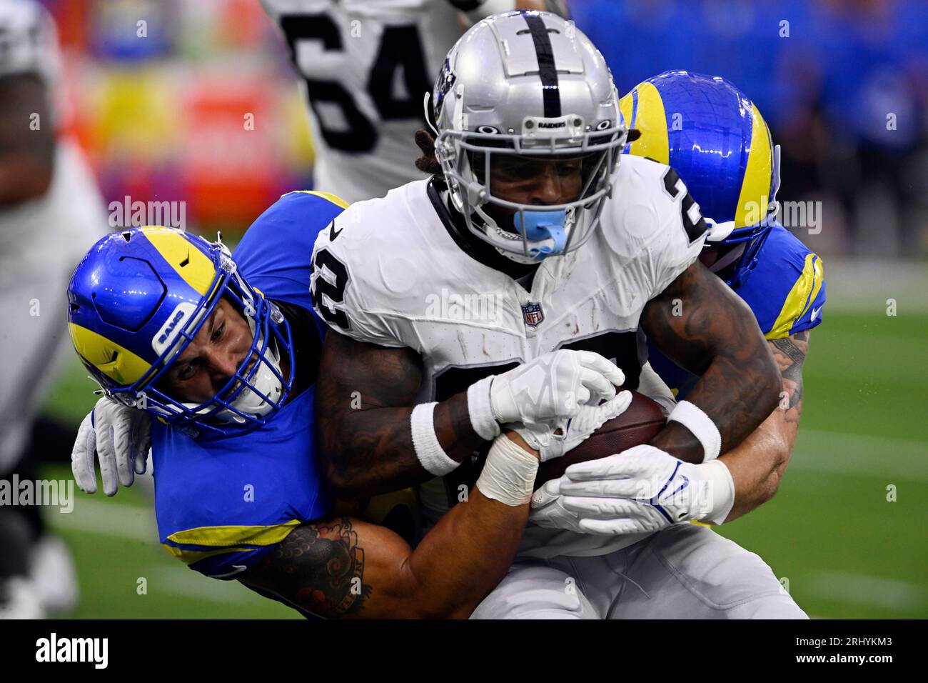 Las Vegas Raiders running back Ameer Abdullah, center, is tackled by ...