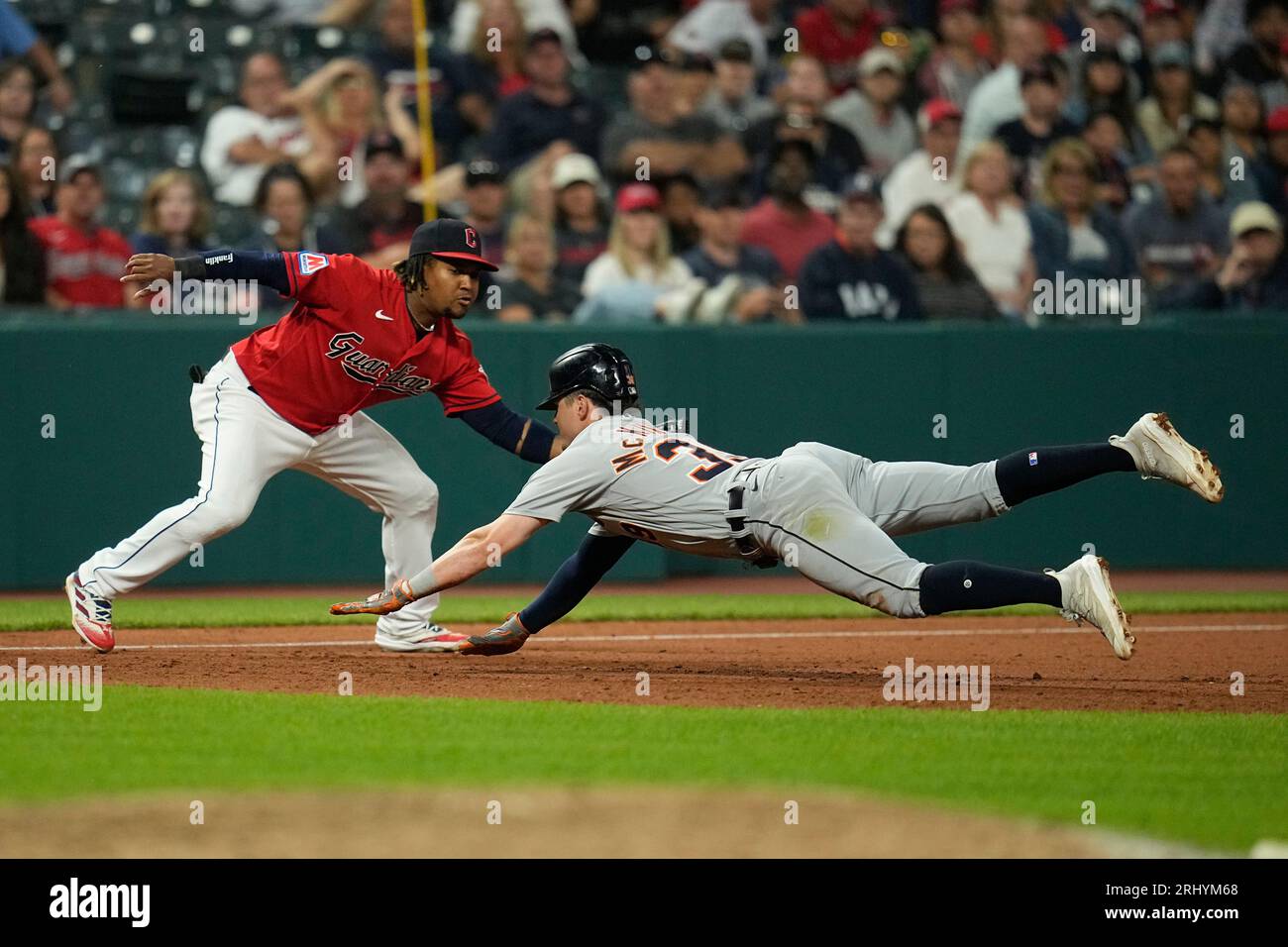 Detroit Tigers' Zach McKinstry, right, advances to third base in front ...