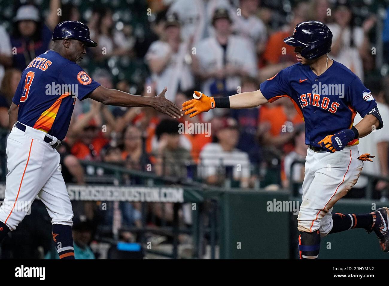 Houston Astros' Mauricio Dubon, right, shakes hands with third base ...