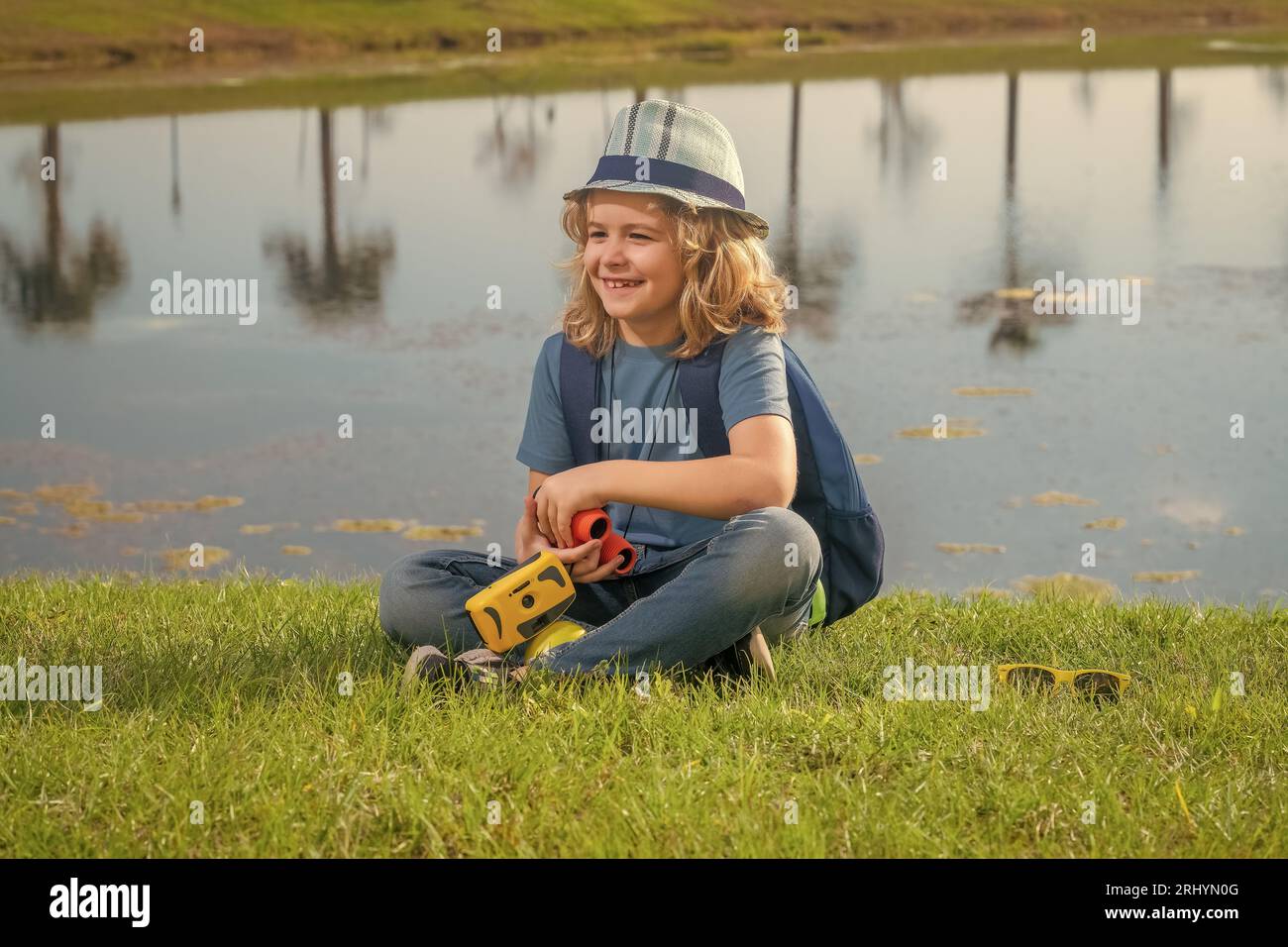 Scout boy wearing explorer hat and backpack outdoor. Explorer and ...