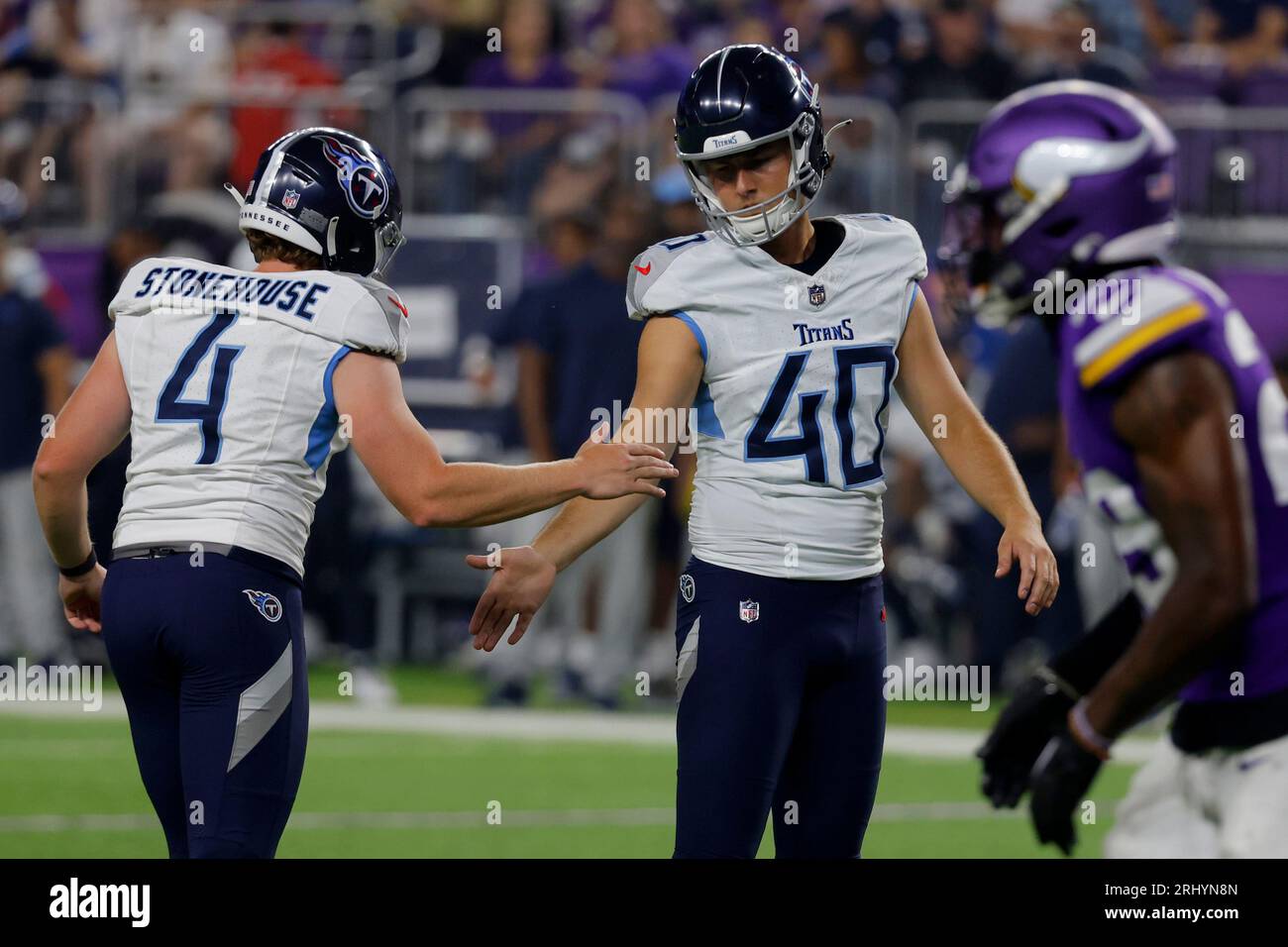 Tennessee Titans' Ryan Stonehouse (4) and place kicker Trey Wolff (40 ...
