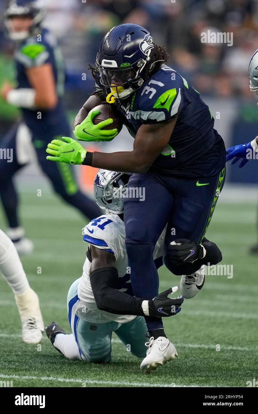 Seattle Seahawks running back DeeJay Dallas is tackled by Dallas ...