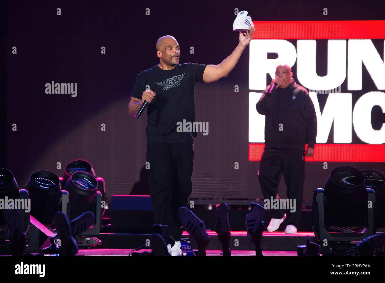 Rapper Darryl McDaniels of Run DMC holds a sneaker from Adidas while ...