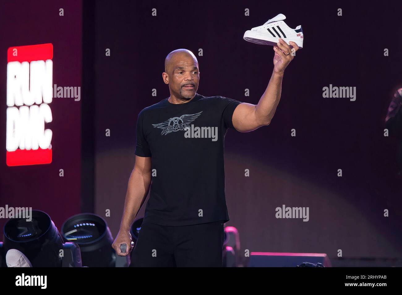 Rapper Darryl McDaniels of Run DMC holds a sneaker from Adidas while ...