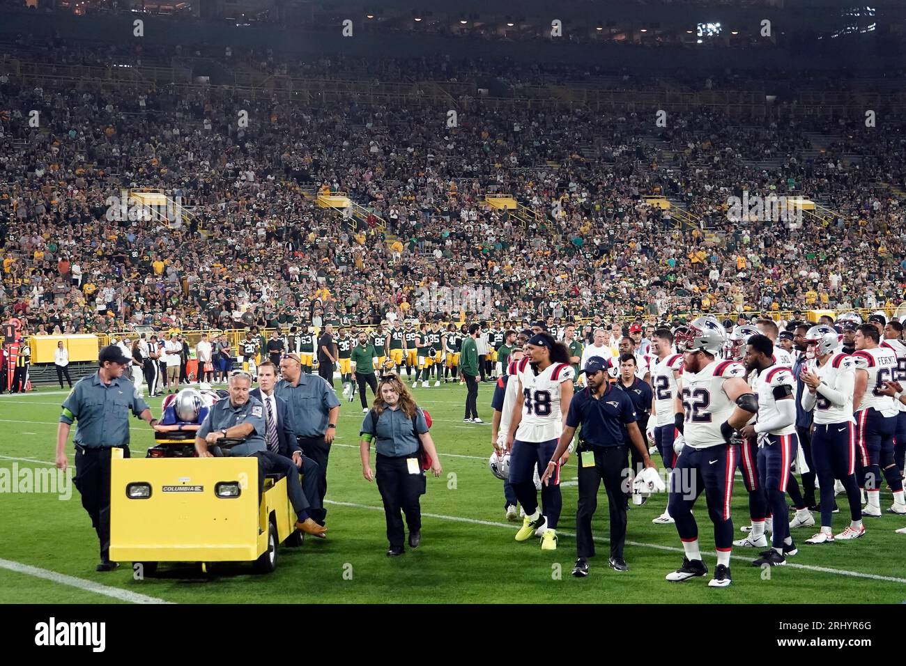 New England Patriots players watch as teammate Isaiah Bolden is brought ...