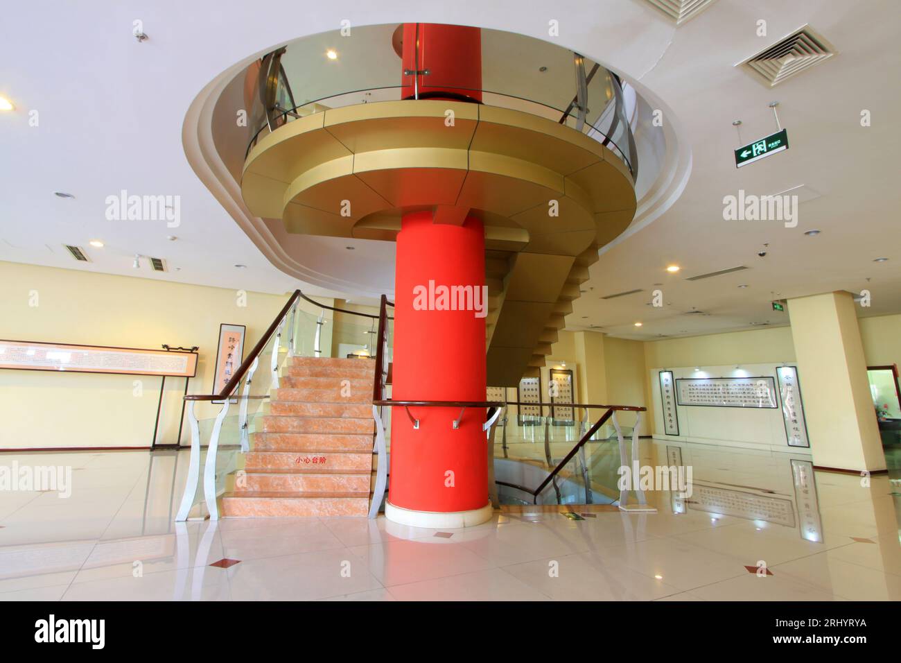 city indoor glass rotary stairs in china Stock Photo - Alamy