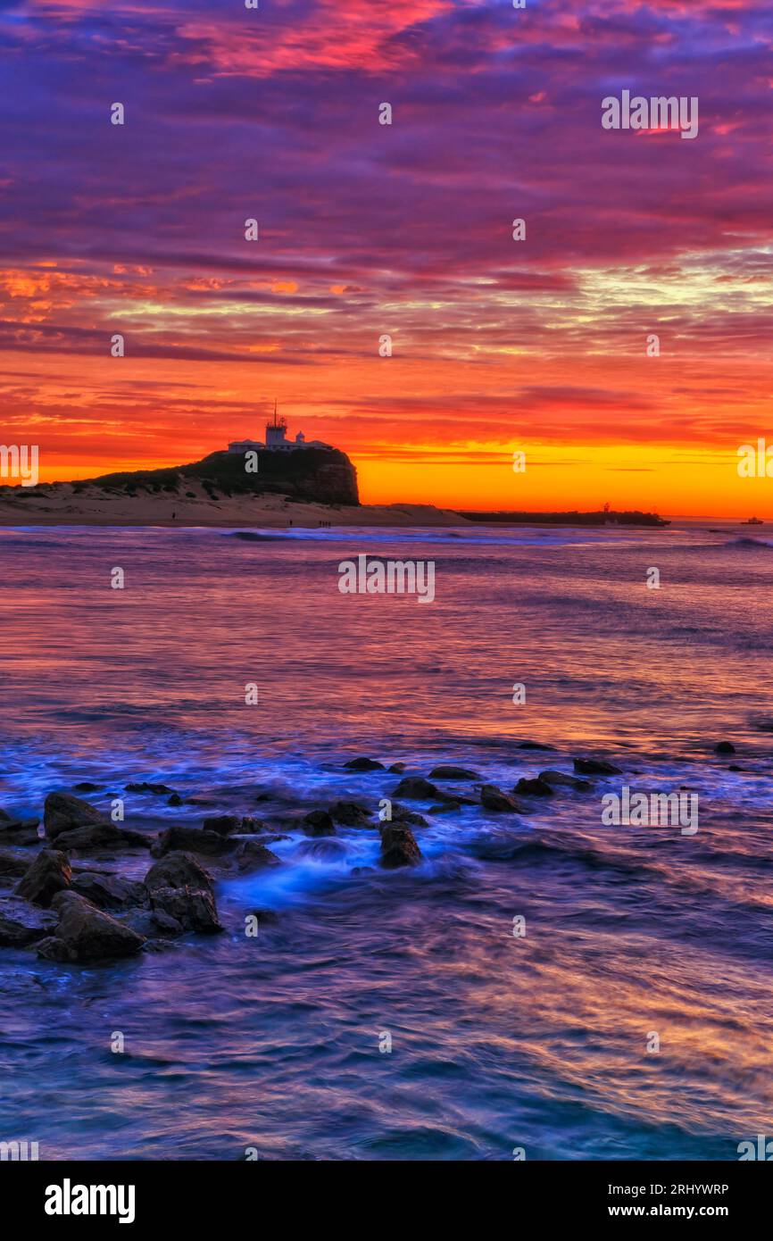 Low tide rocks at Nobbys head sandy beach of Newcastle city in ...