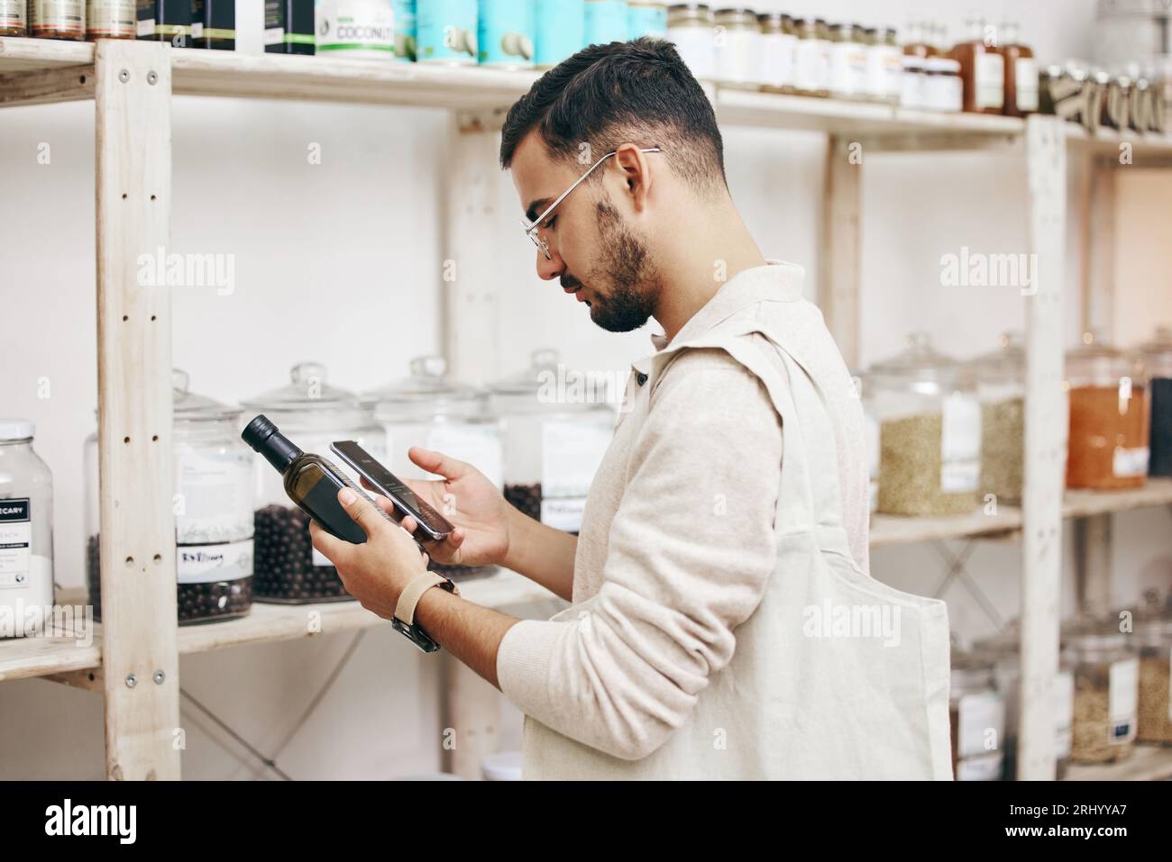 Man, shopping and phone for reading grocery product, healthy food and ...