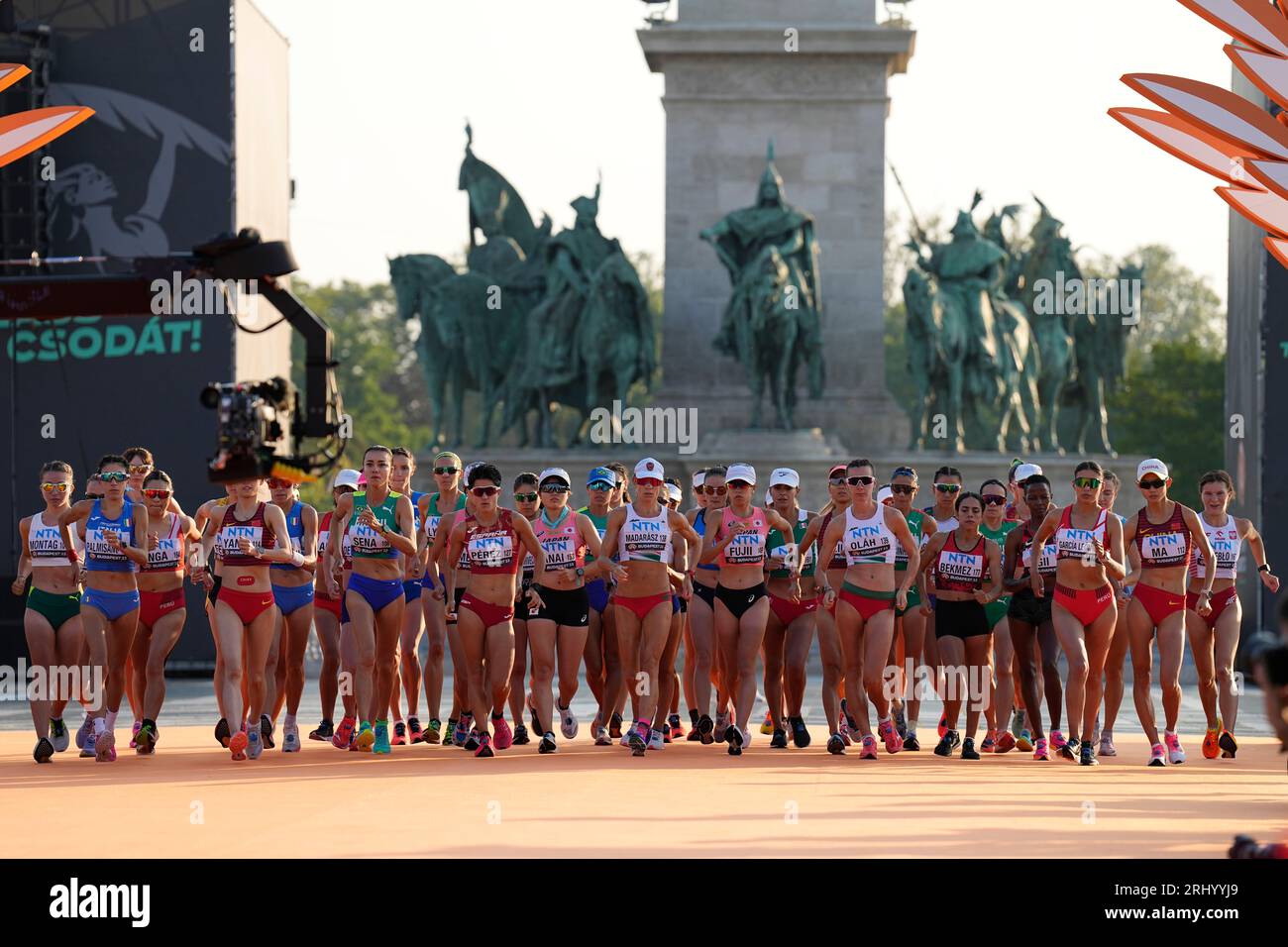 Race walkers start in the women's 20-kilometer race walk final during ...