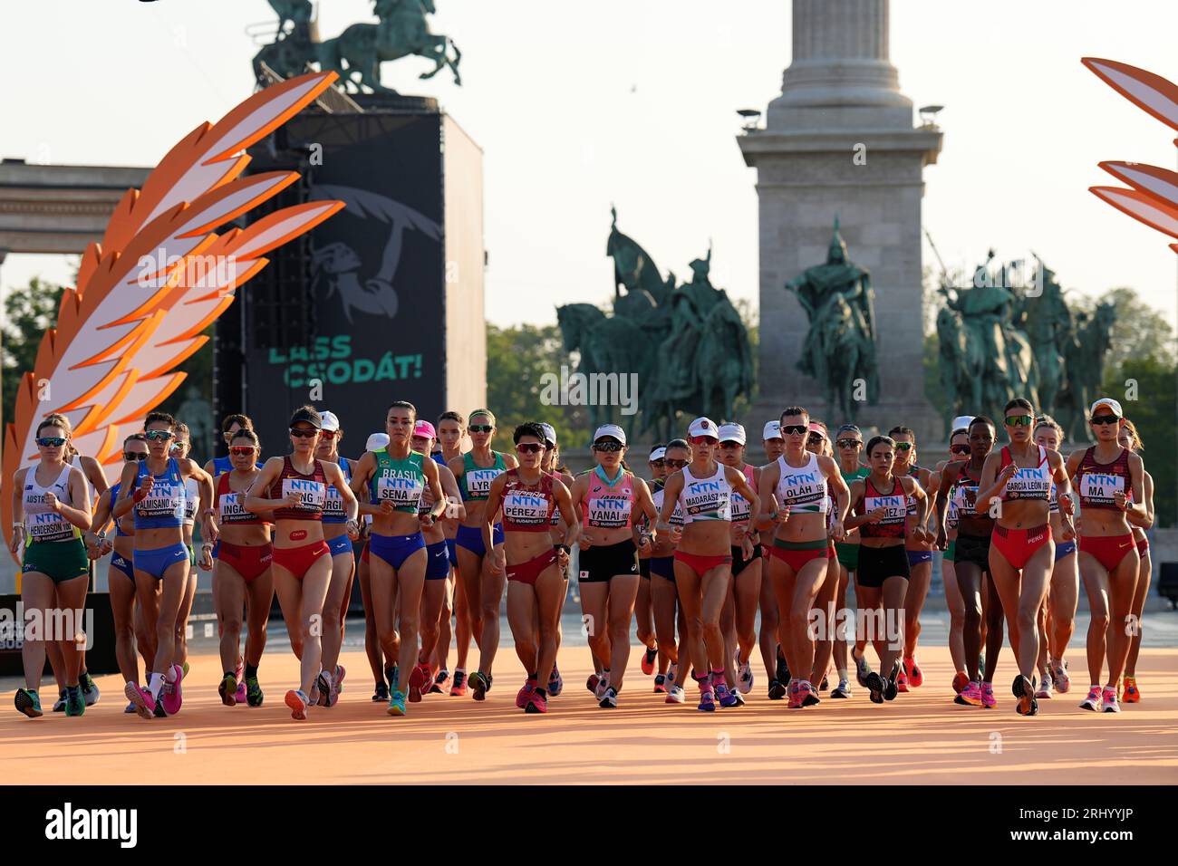 Race walkers start in the women's 20-kilometer race walk final during ...