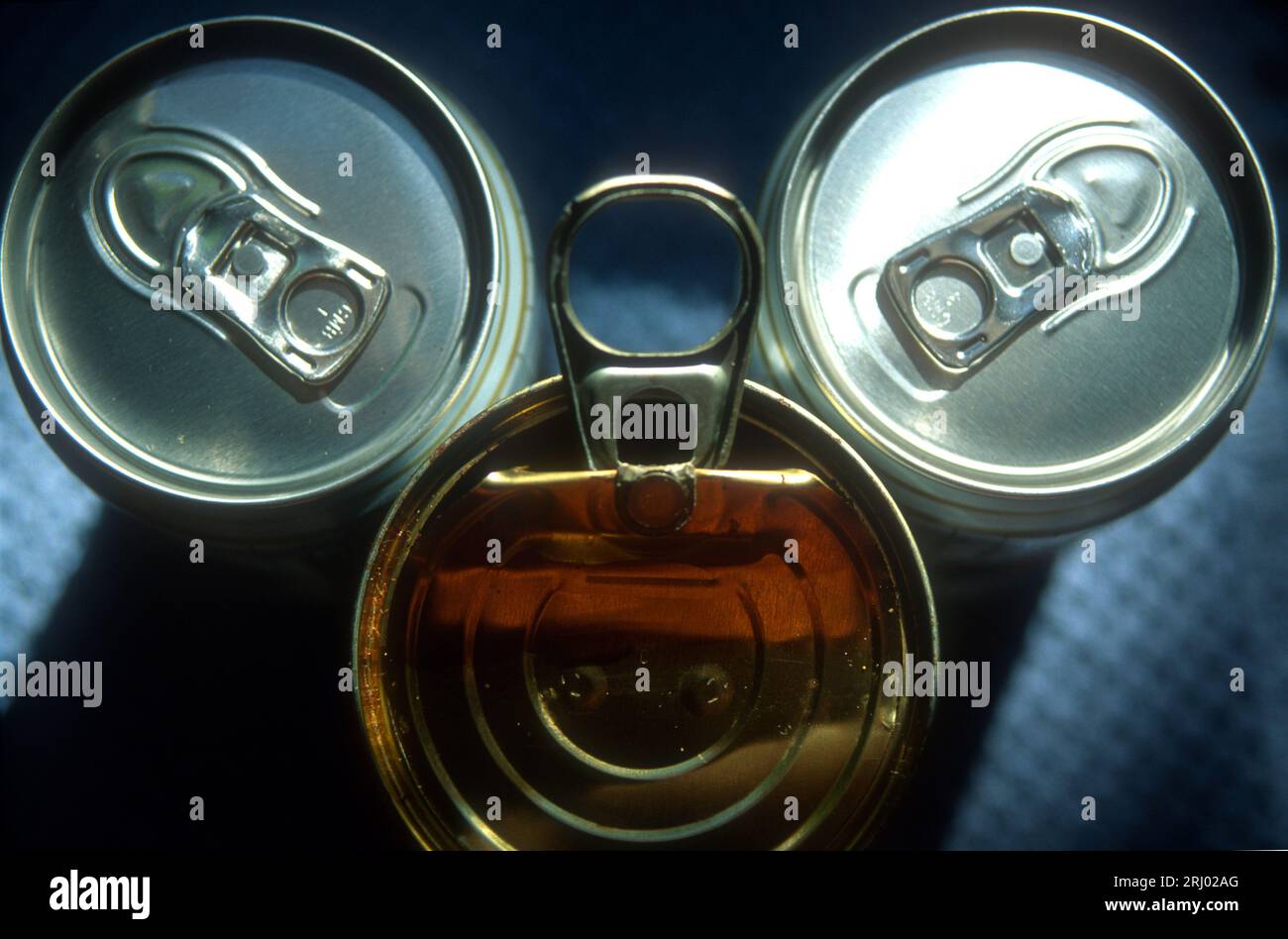 Ring-pull cans, two closed and one open Stock Photo - Alamy