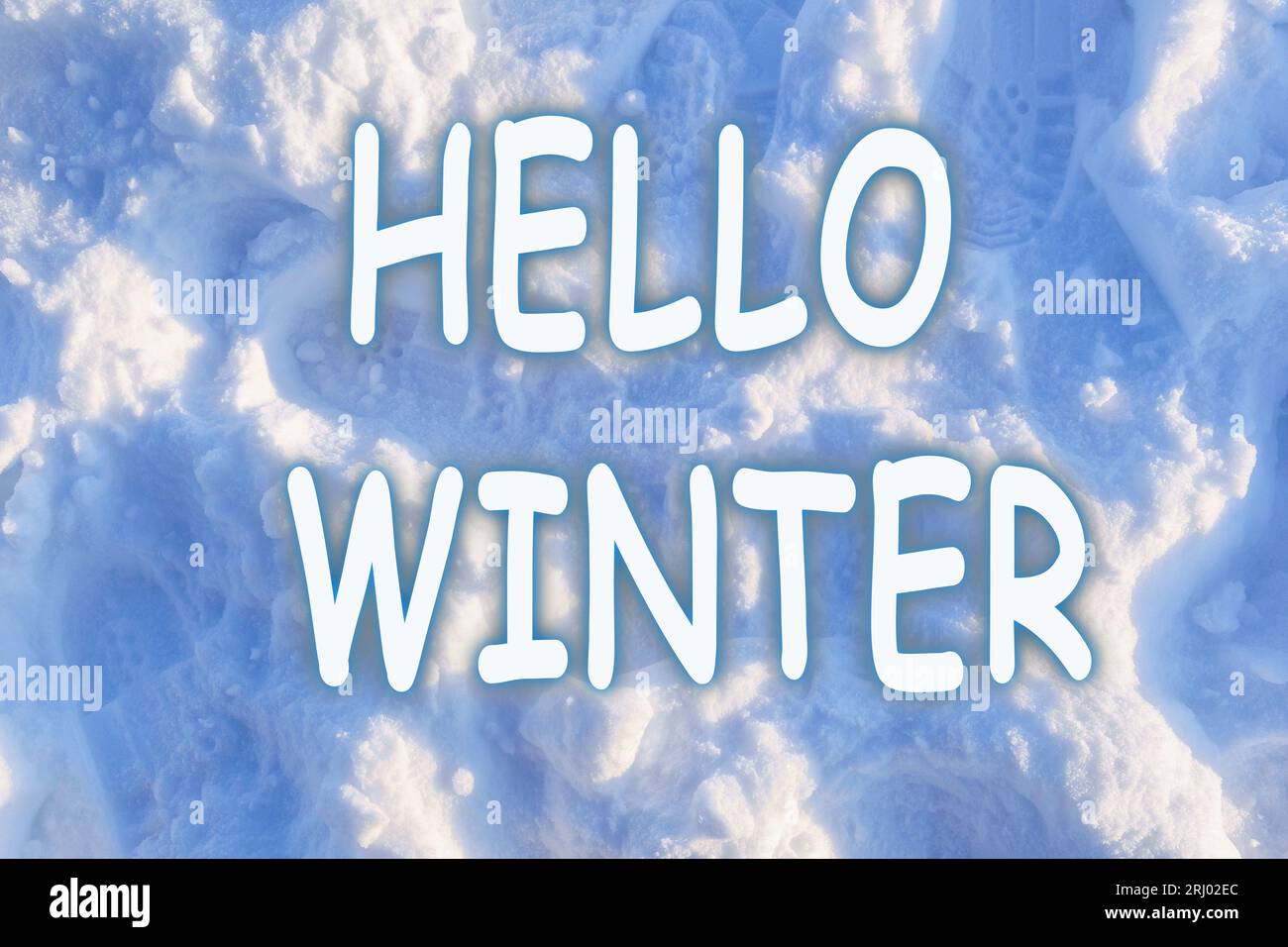 Hello Winter lettering inscription, human footprints in the snow ...