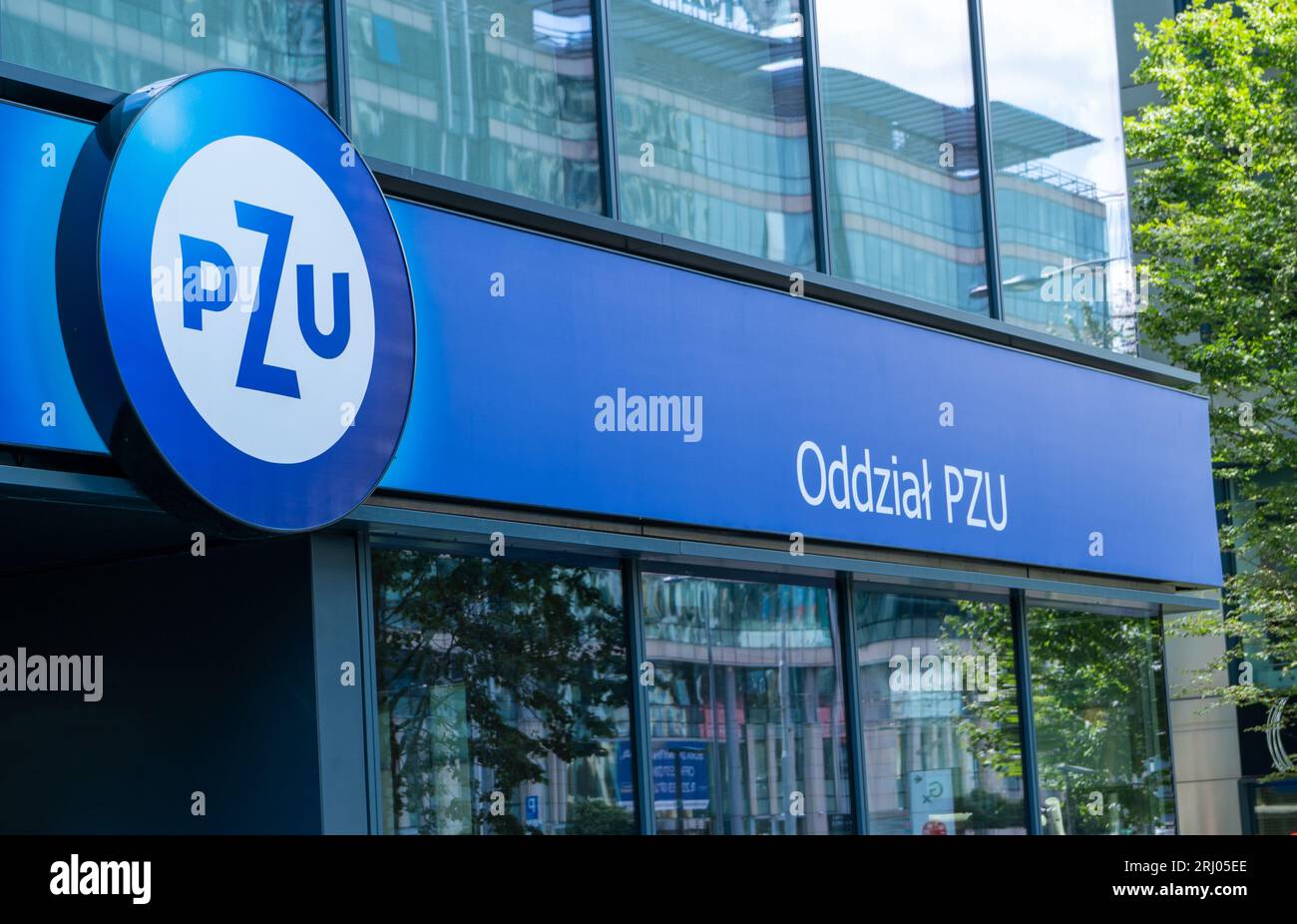 Polish insurance company PZU. Blue logo at the entrance of the building ...