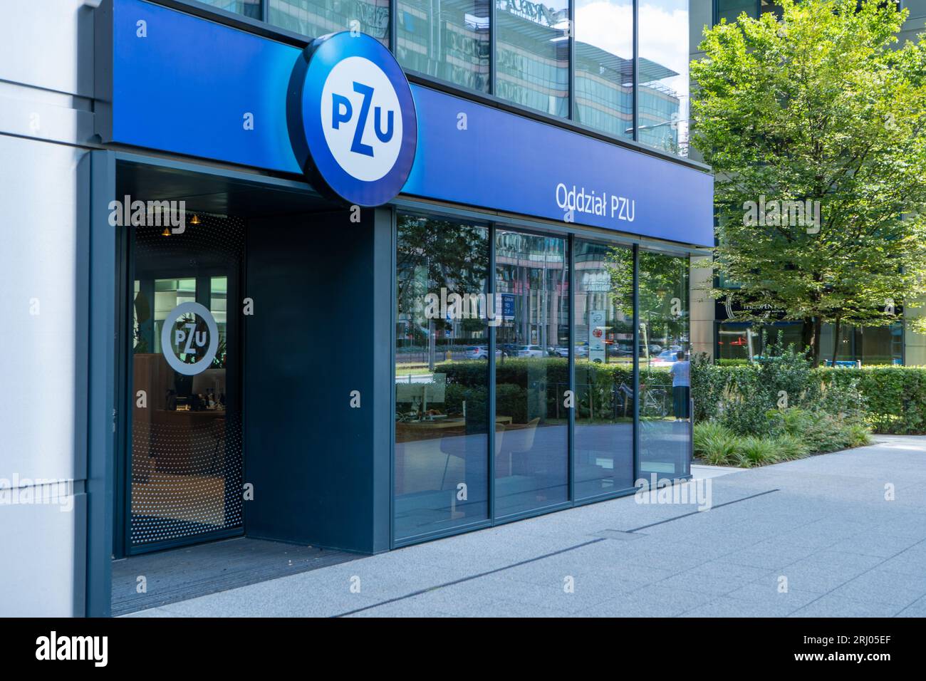 Polish insurance company PZU. Blue logo at the entrance of the building ...