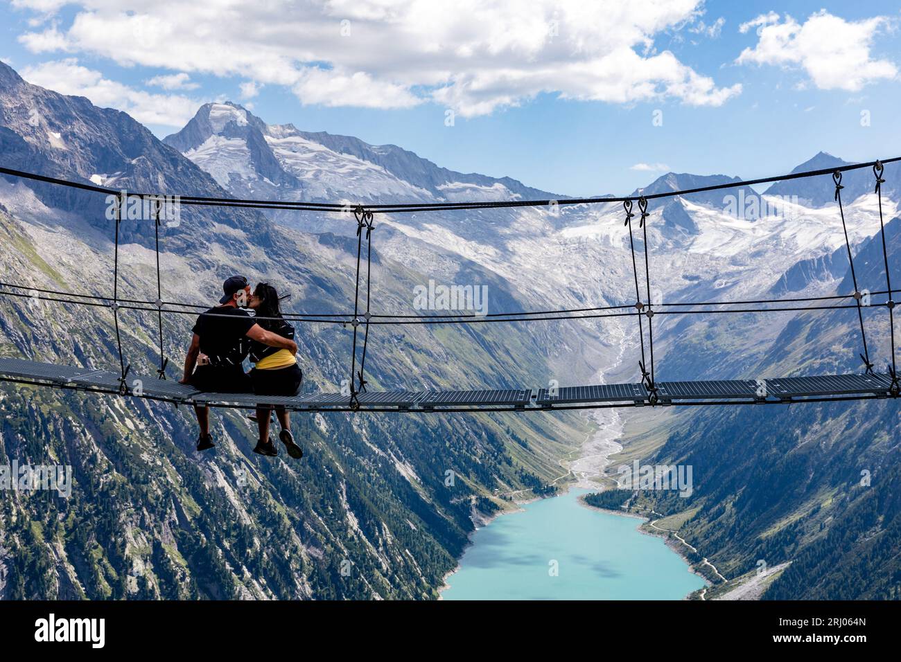 Zillertaler Alpen, Austria. 19th Aug, 2023. A woman and a man kiss on a ...
