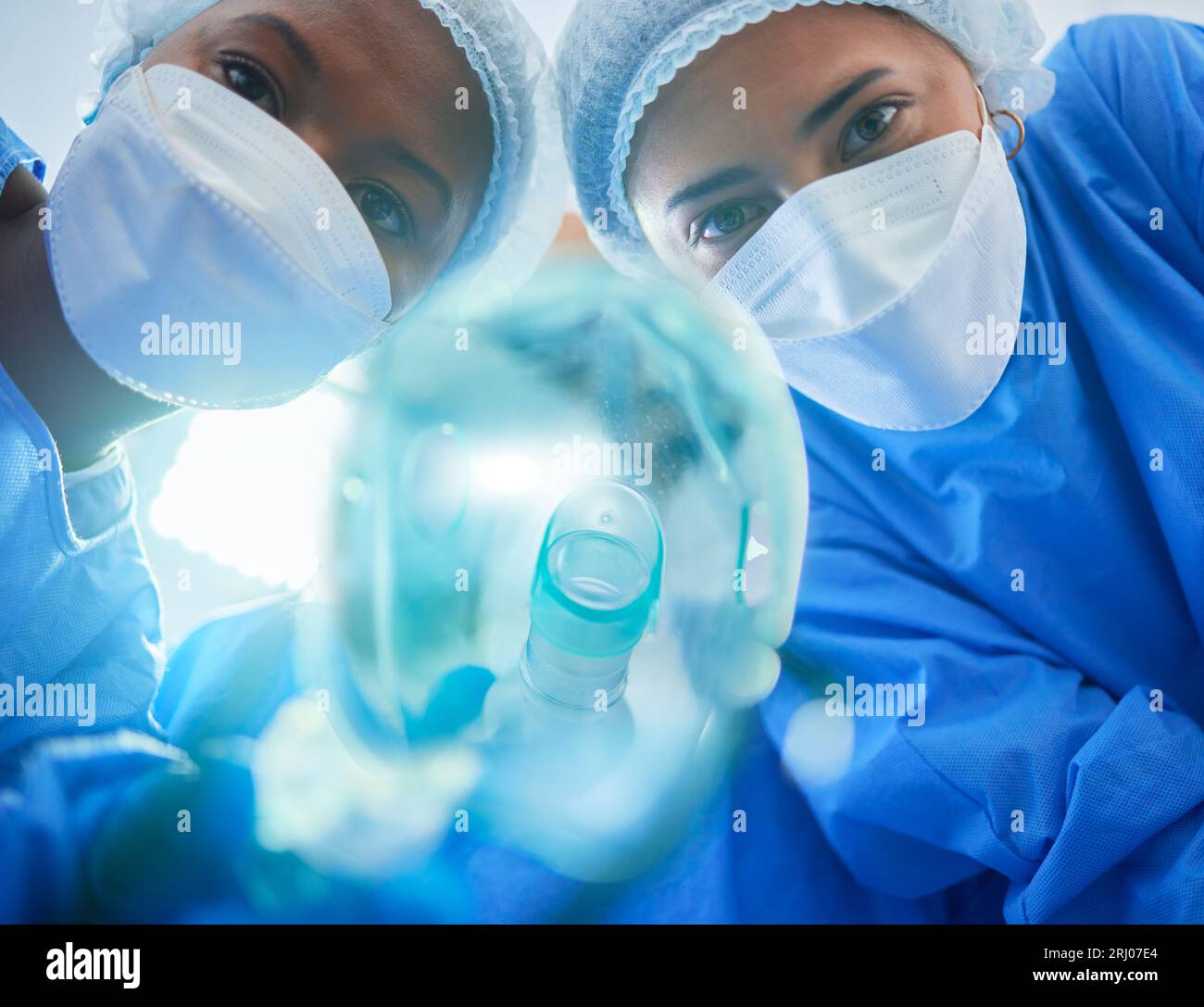Surgery, anesthesia and doctors with oxygen mask for medical service ...