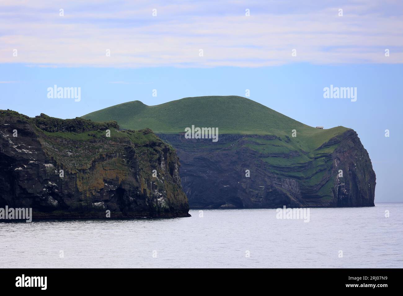 View of the small offshore island of Bjarnarey and Ellidaey ...