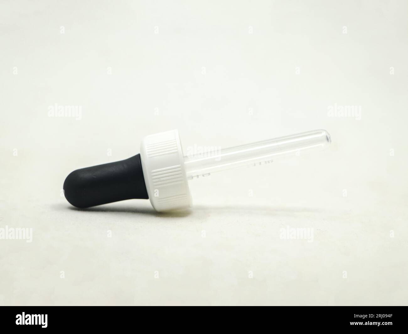 closeup shot of a plastic eye dropper pipette tool used for medical and ...