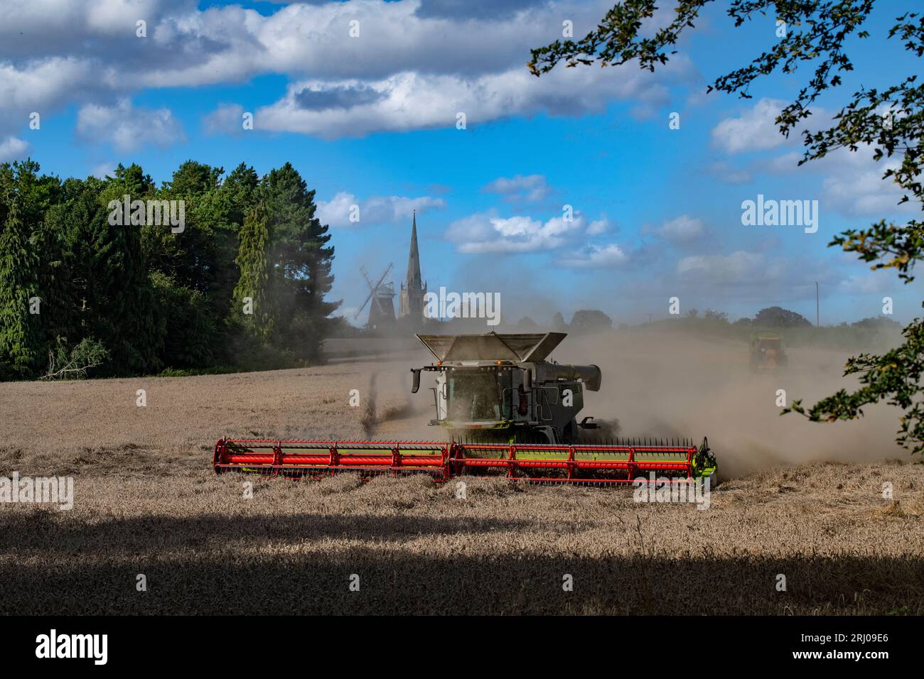 Combine harvester being used harvest hi-res stock photography and ...