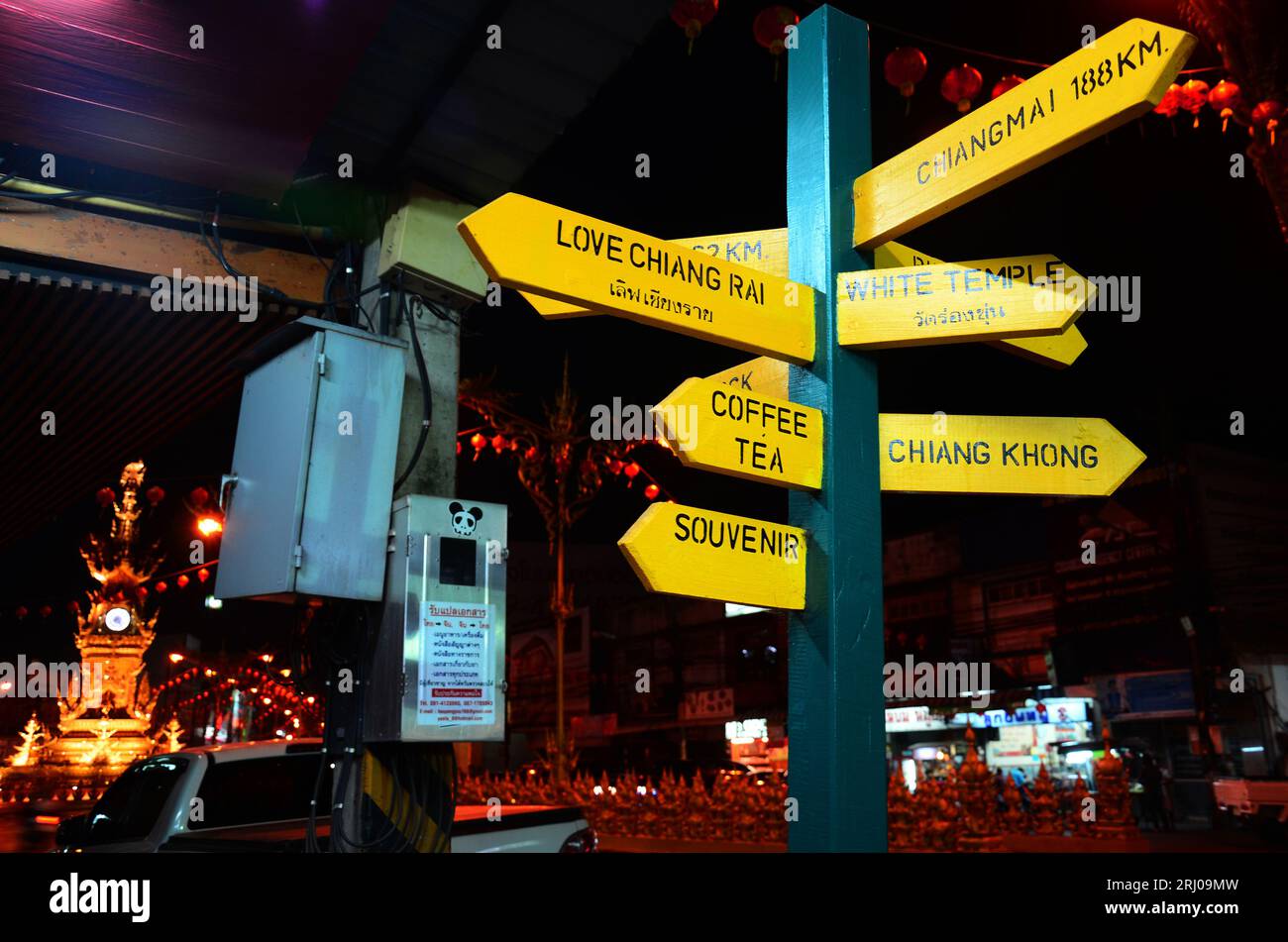 Direction guide wooden signpost on street in alley for thai people and ...