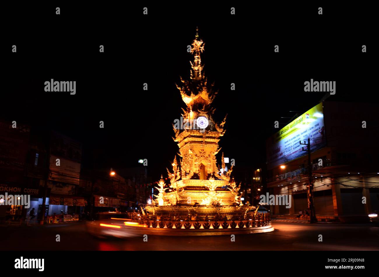 Landscape cityscape and traffic road at roundabout circle golden clock ...
