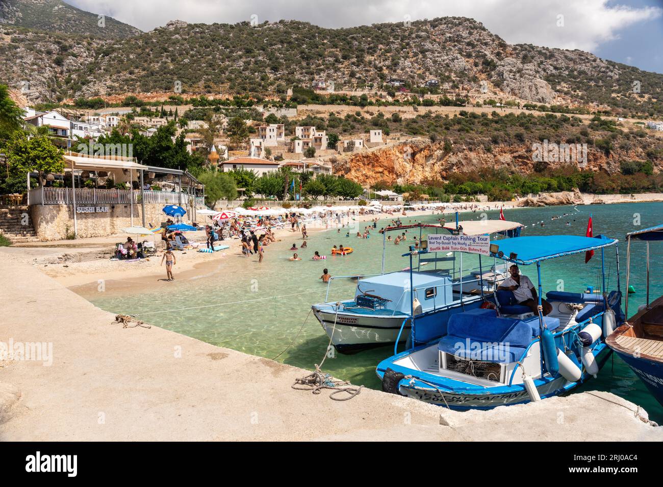 Fishing boats in Kalkan Bay with Kalkan beach in the background, Kalkan ...