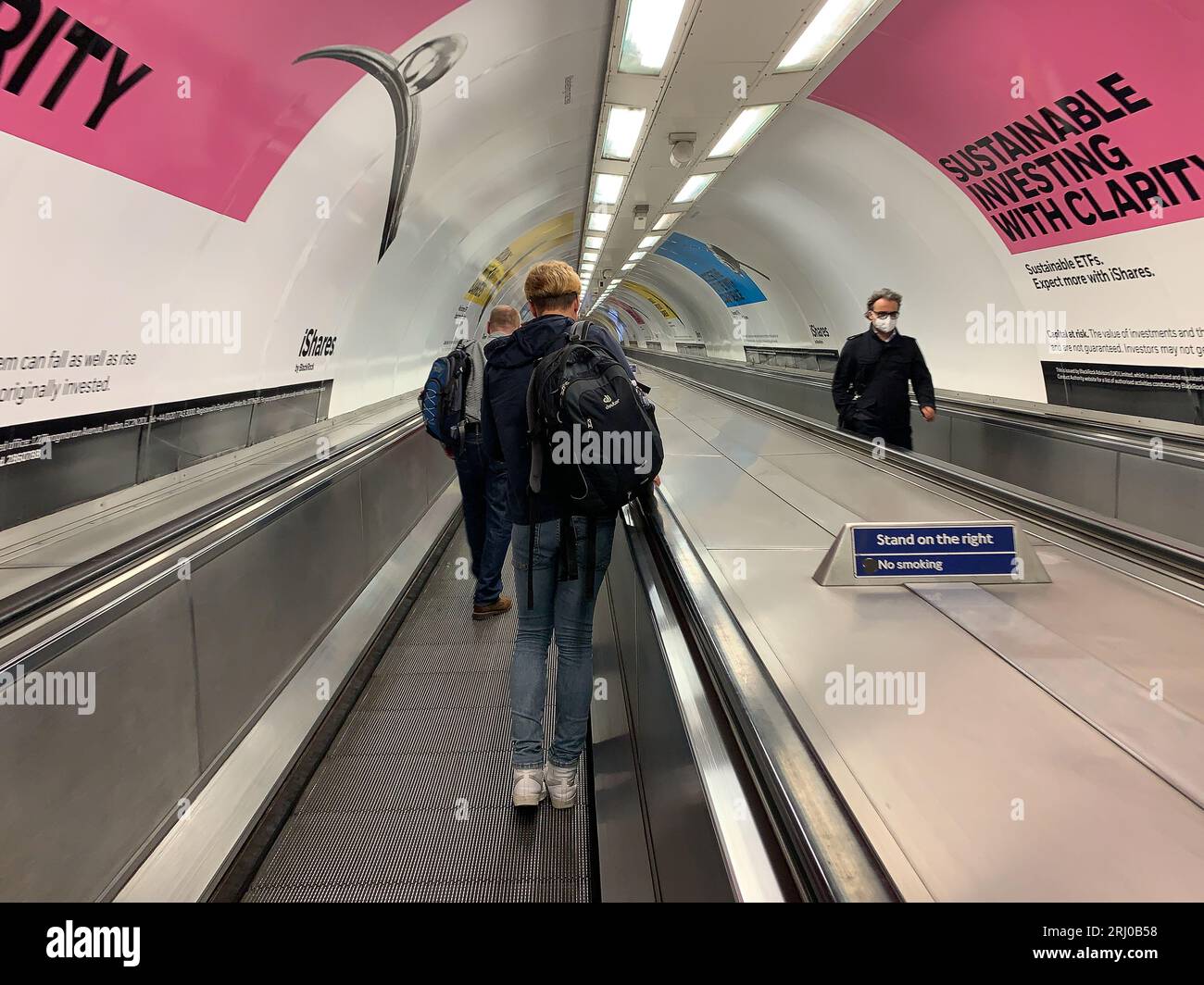 London, UK. 10th August, 2023. Passengers on a moving travelator at ...