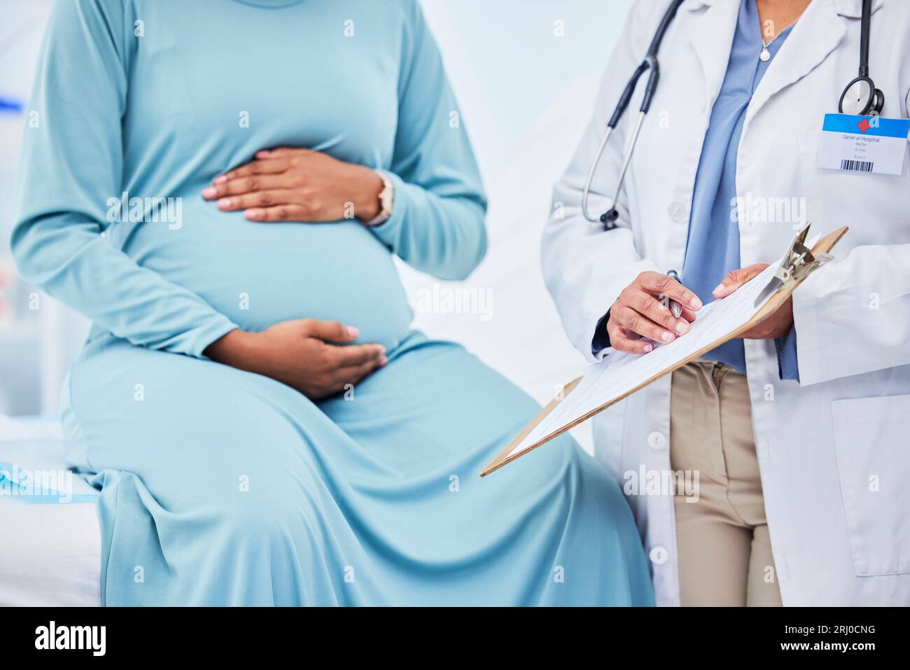 Doctor, woman hands and pregnancy in a hospital with mama, stomach and ...
