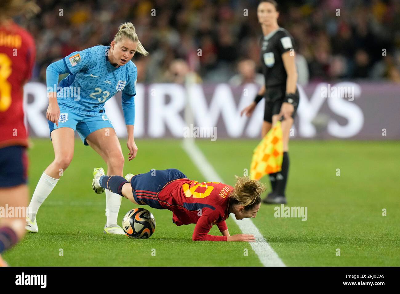 Spain's Olga Carmona, right, falls next to England's Alessia Russo ...