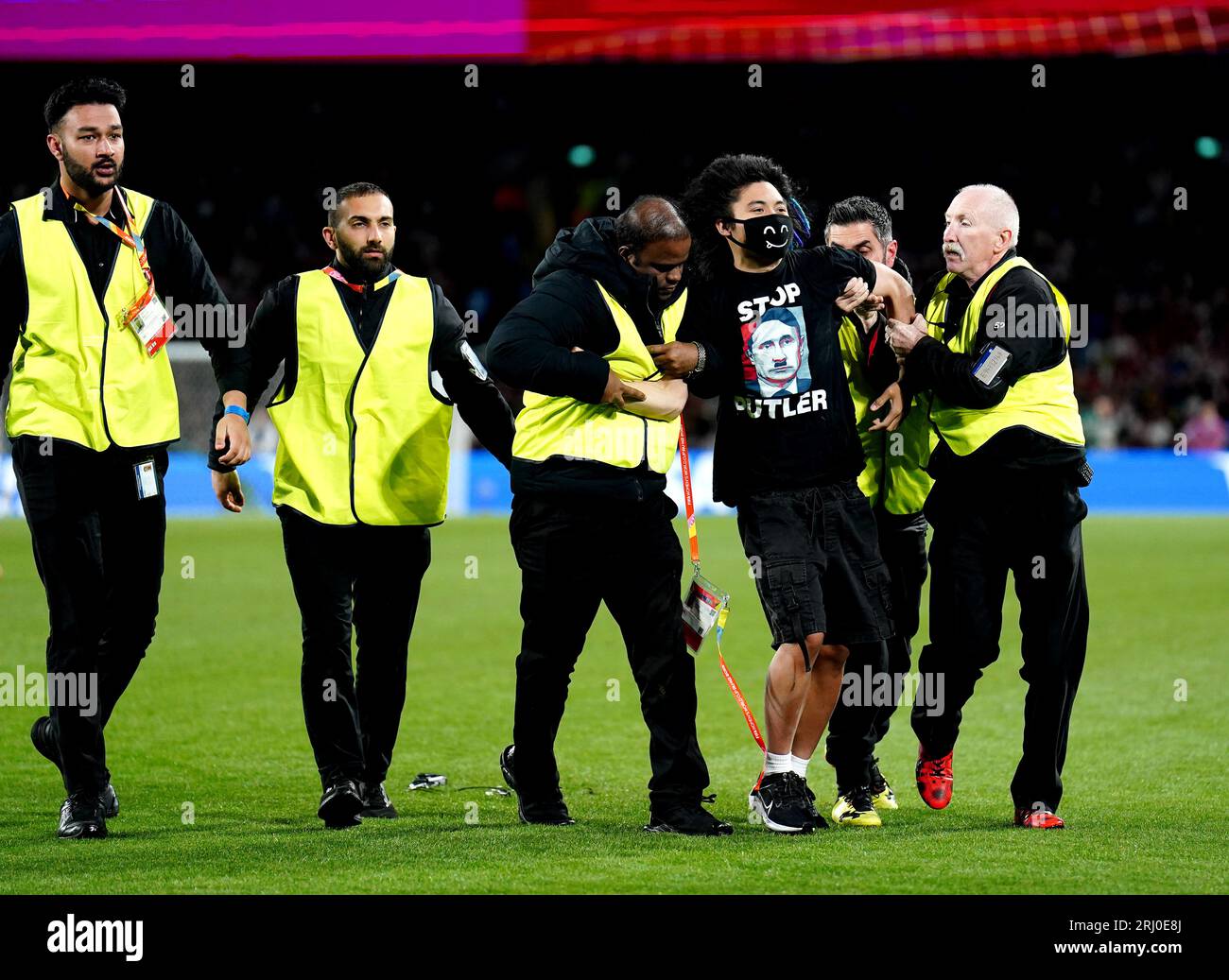 A pitch invader is removed by security during the FIFA Women's World ...