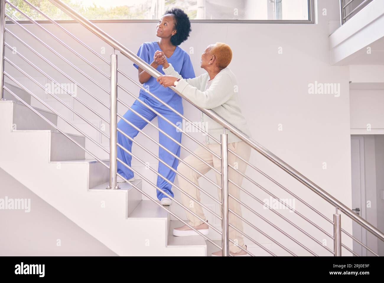 Stairs, nurse and help senior woman, holding hands and assistance in ...