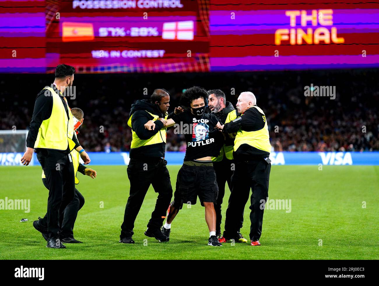 A pitch invader is removed by security during the FIFA Women's World ...
