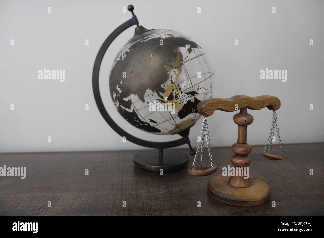 transparent world globe map and wooden scales of justice. lawyer scales ...