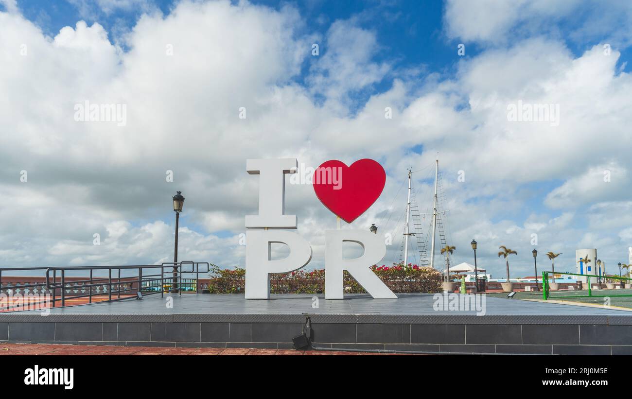 I love Puerto Rico sign on sunny day in front of the San Juan buildings ...