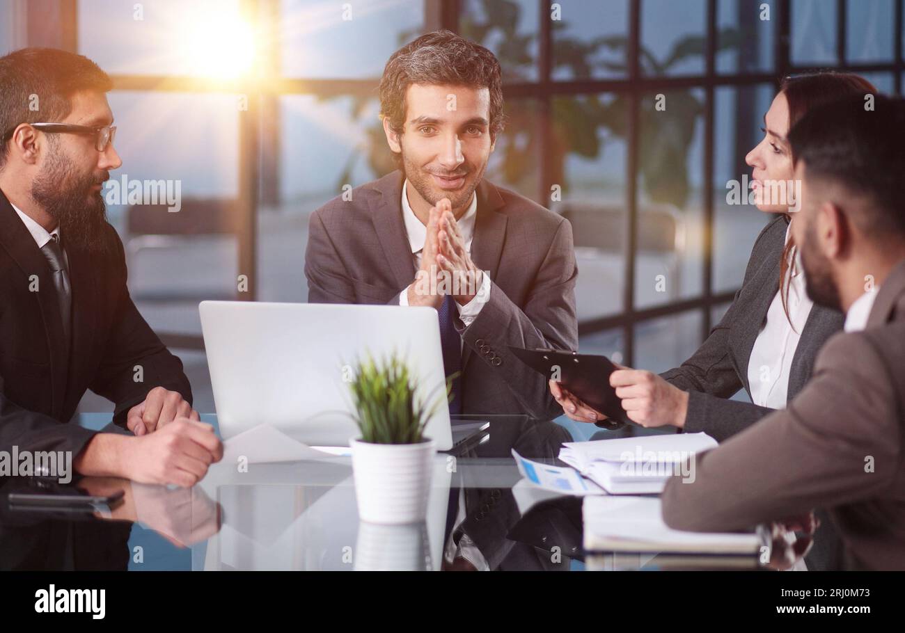 Teamwork - discussion in the office. young and successful Stock Photo ...