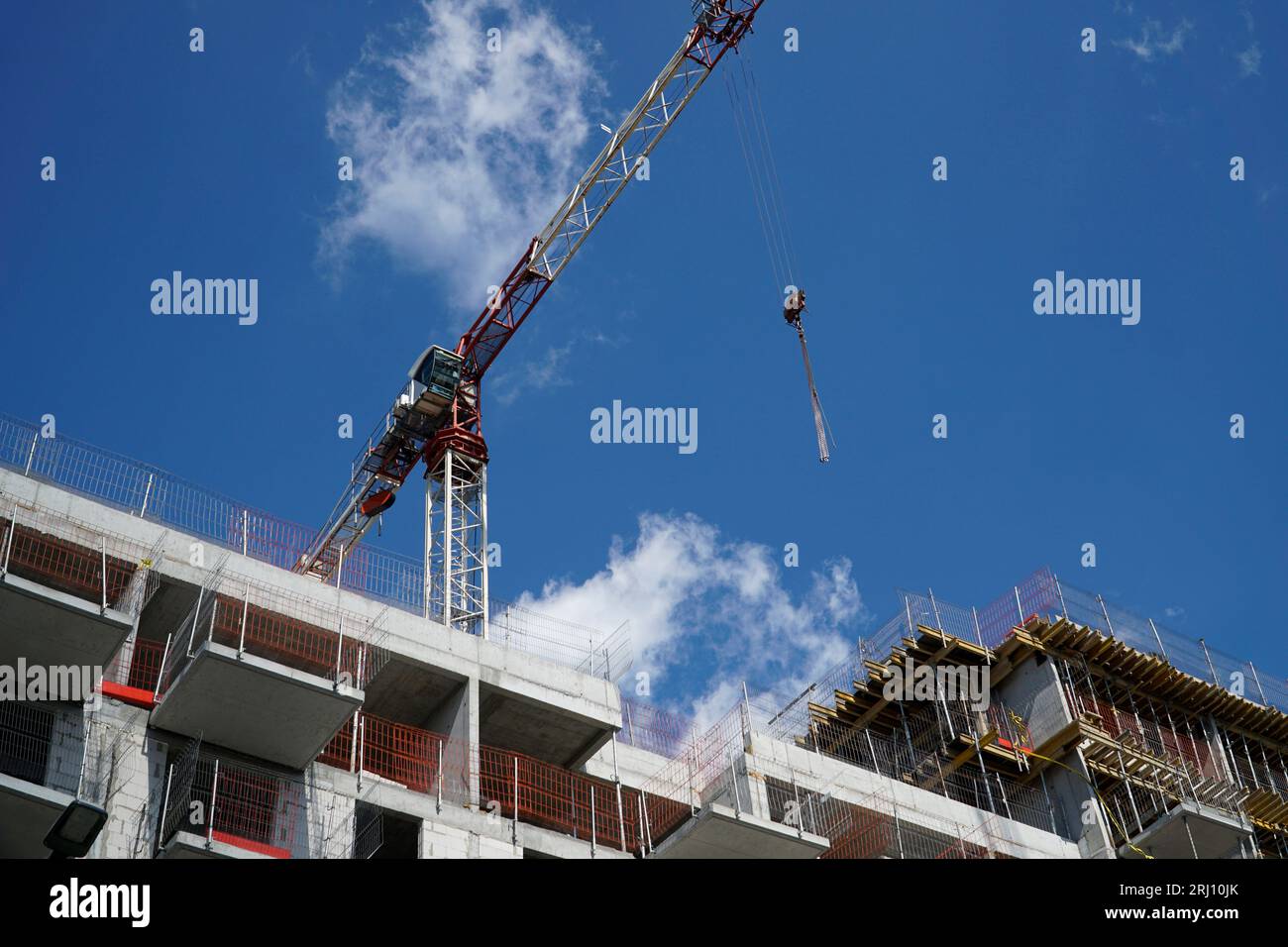 Multi storey residential building and construction crane Stock Photo ...