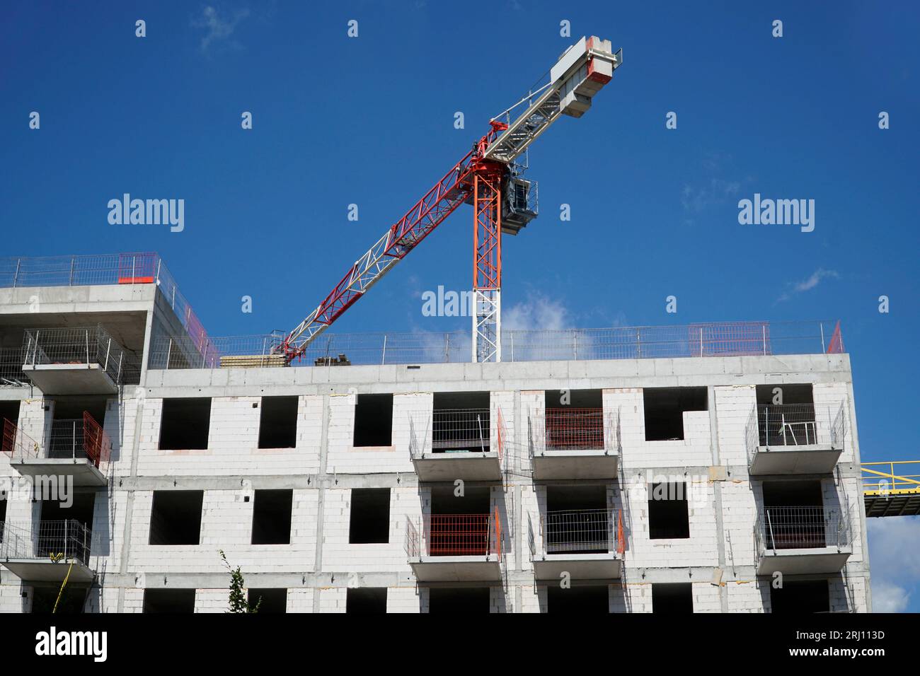 Multi storey residential building and construction crane Stock Photo ...