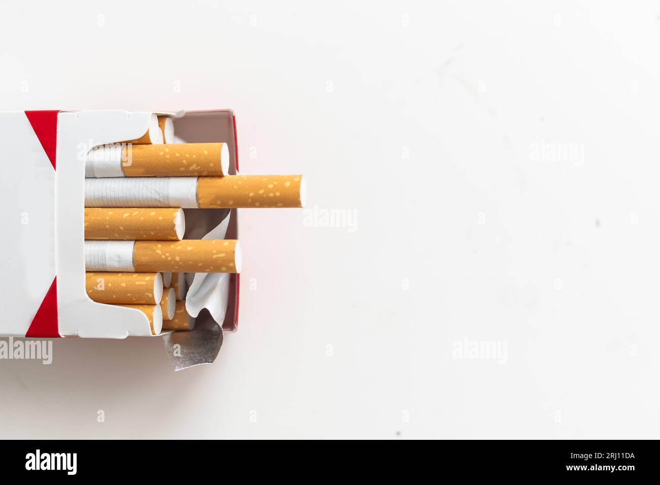 Open blue pack of cigarettes isolated on white background. Box of ...