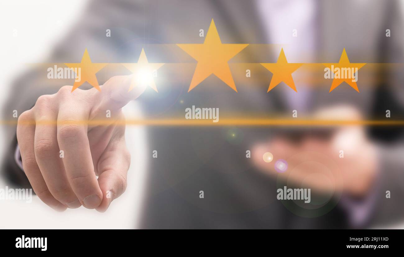 The person's hand pointing at hovering stars. Rating, evaluation Stock ...