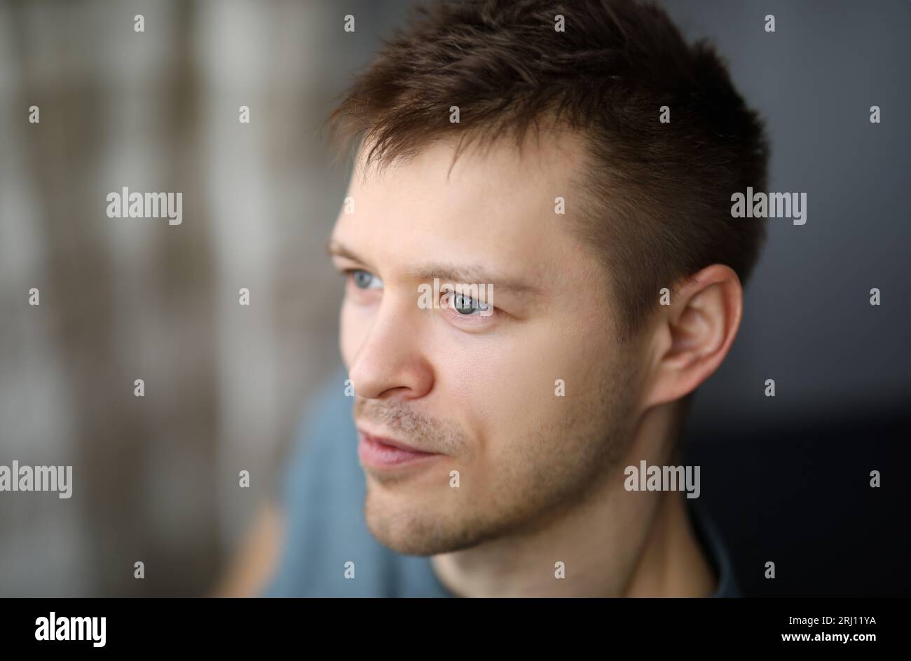 Close-up portrait in profile of an ordinary guy Stock Photo - Alamy