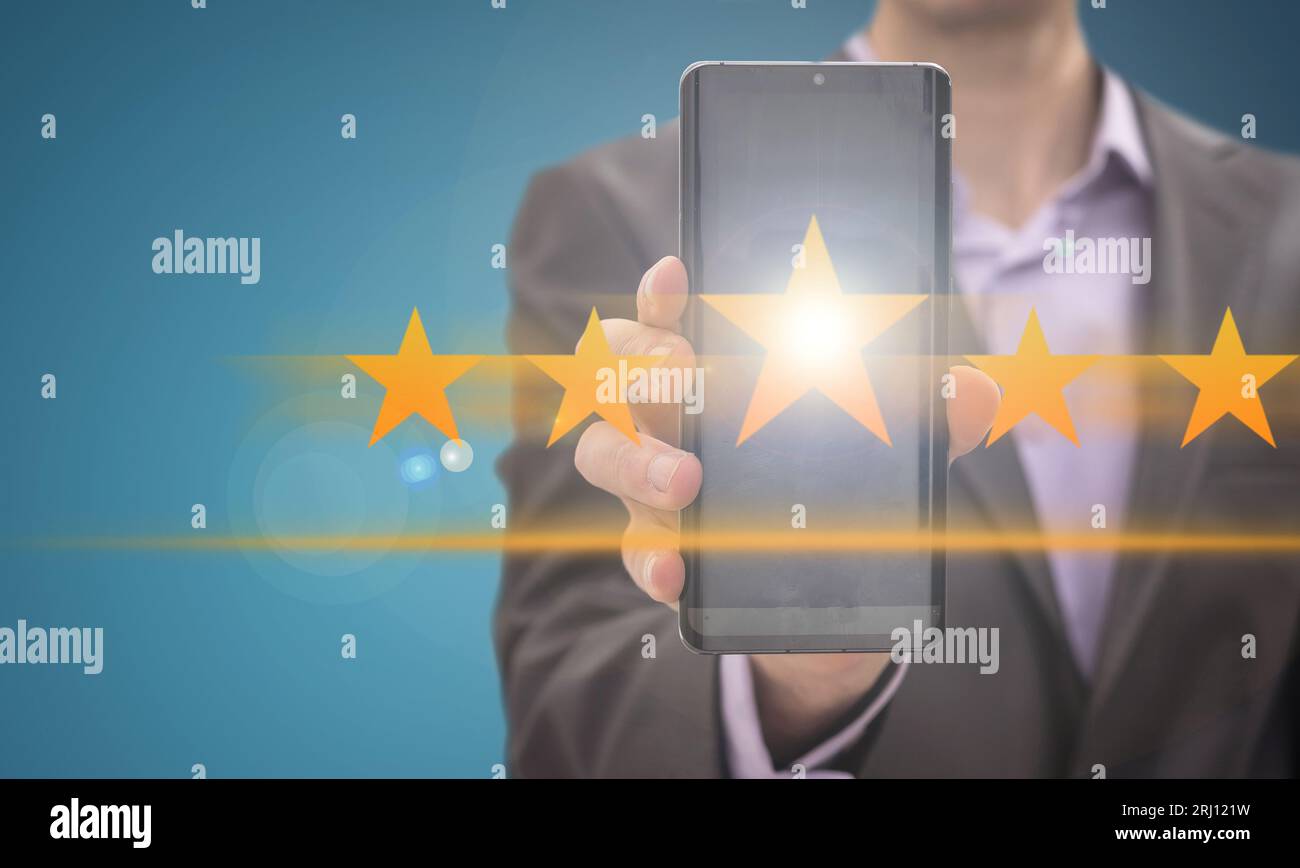 Please rate us banner wtih customer hand give five golden stars Stock ...