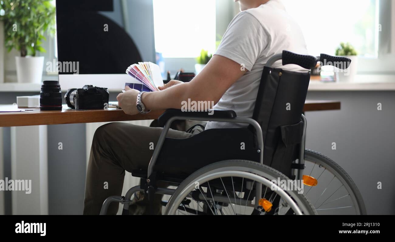 Talented man in adapted workplace Stock Photo - Alamy