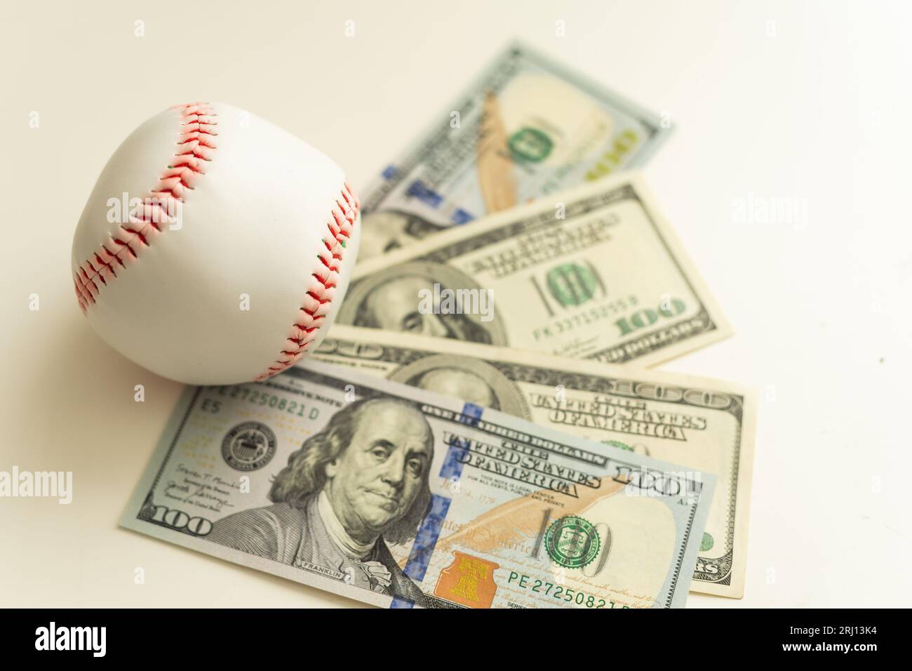 Closeup concept of baseball and money Stock Photo - Alamy