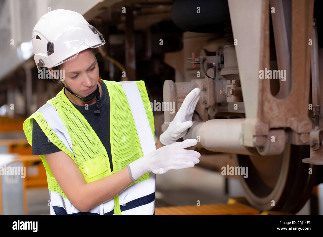 Young caucasian engineer woman or worker looking and checking electric ...