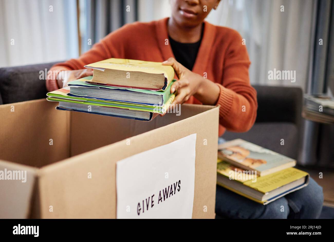 Donation box, charity and woman with books for nonprofit and cardboard ...